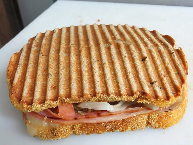 The panini press doesn't lie—perfectly grilled bread housing layers of meat and cheese that make standard lunch options seem like a sad compromise.
