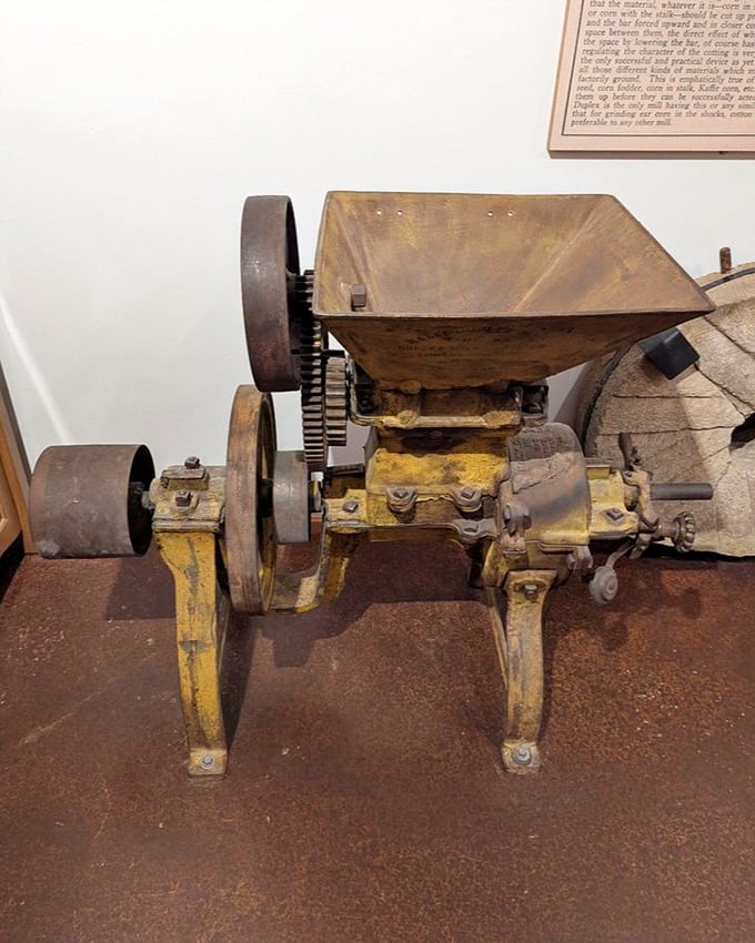 This antique gristmill machinery stands as testament to human ingenuity. The millpond's namesake equipment shows how water powered progress.