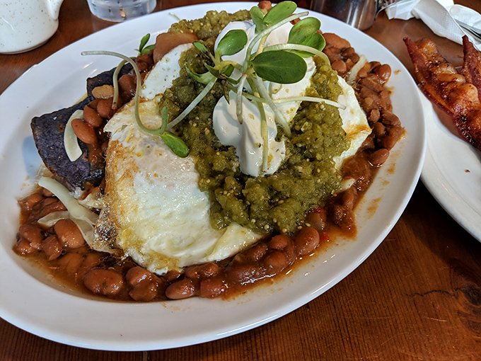 Huevos with attitude—crispy tortilla, perfectly runny eggs, and salsa verde that delivers just enough heat to wake up your taste buds without traumatizing them.