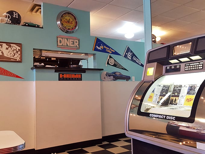 Sports pennants and vintage signs create that perfect diner atmosphere – where nostalgia is always on the menu alongside the daily specials.