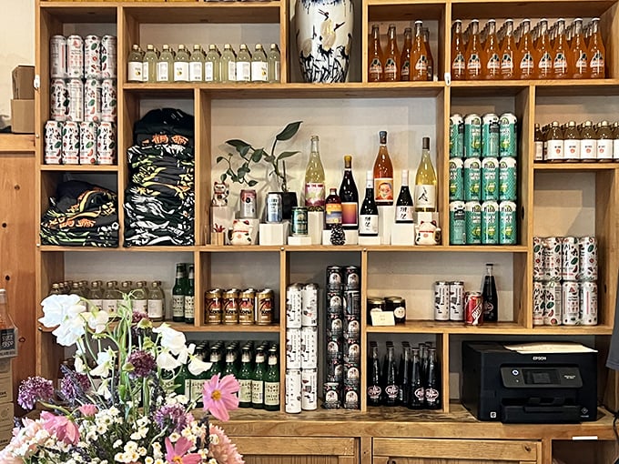 The beverage wall isn't just storage—it's a carefully curated collection. From craft beers to specialty teas, each bottle promises the perfect companion to your meal.