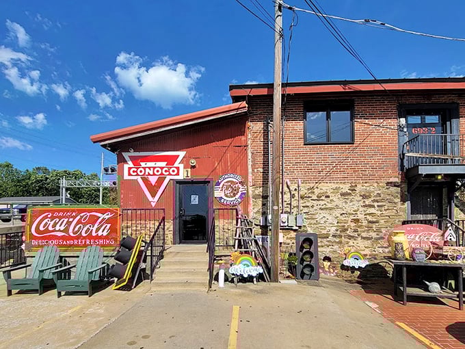 The outdoor entrance showcases vintage Americana that would make Route 66 enthusiasts weep with joy. Coca-Cola, Conoco, and comfortable chairs—nostalgia served with a side of sunshine.