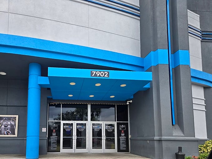The unassuming exterior of Elev8 Fun Tampa hides the neon wonderland within, like a corporate building that secretly moonlights as a disco.