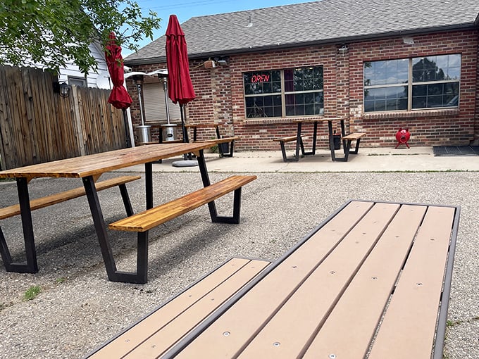 Outdoor picnic tables waiting for summer gatherings – because the only thing better than B-Man's BBQ is enjoying it under Colorado's big blue sky.