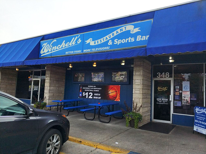 "Better Food! More Televisions!"—a slogan that perfectly captures Winchell's dual identity. The outdoor seating area welcomes guests before they even step inside.