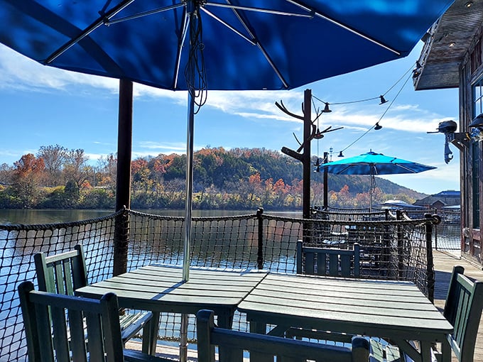 Outdoor seating that turns lunch into a lakeside event. Those blue umbrellas aren't just shade—they're the perfect frame for Ozark autumn colors.