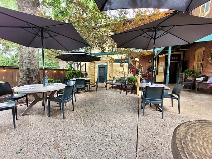 The patio at Hendel's – where summer evenings become magical under umbrellas and dappled sunlight. Missouri's version of dining al fresco done absolutely right.