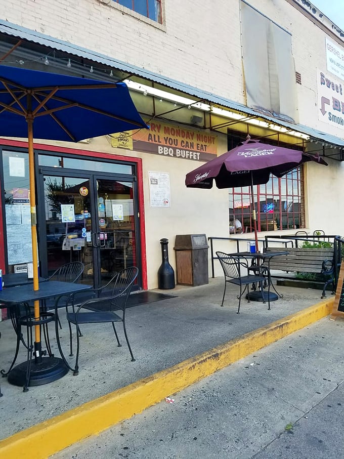 The outdoor seating area whispers promises of Monday night all-you-can-eat barbecue buffets – a siren song few can resist.