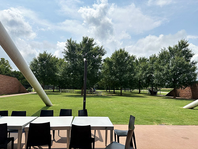The outdoor seating area offers a moment of tranquility after the sensory explosion inside—a place to digest both your burger and the experience.