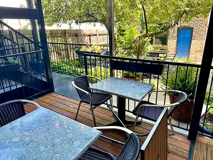 The outdoor seating area: where Chicago summer days meet Mediterranean vacation vibes in perfect, breezy harmony.