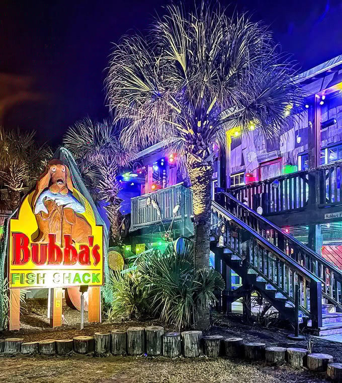 By night, Bubba's transforms into a twinkling seafood wonderland. The palm trees sway as if dancing to the rhythm of satisfied diners inside.