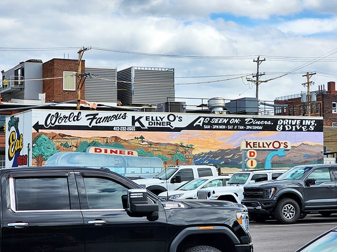 The mural proudly announces Kelly O's television fame, but locals knew this place was a star long before the cameras arrived.