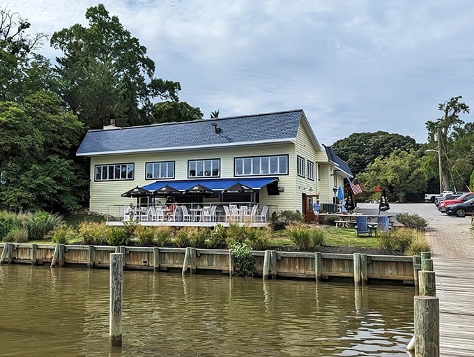 The waterfront view from outside reveals why this unassuming yellow building has become such a beloved local treasure.