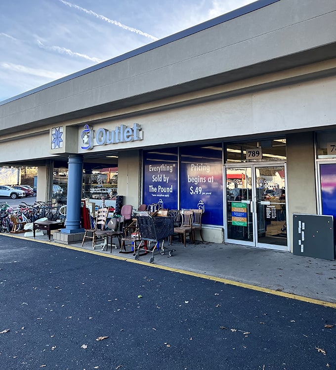 The Outlet section promises bargains by the pound, where furniture patiently waits outside for its next home.