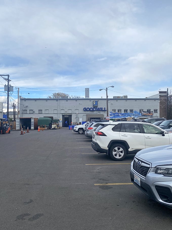 The unassuming parking lot reveals nothing of the wonders within—like a speakeasy for bargain hunters and treasure seekers.