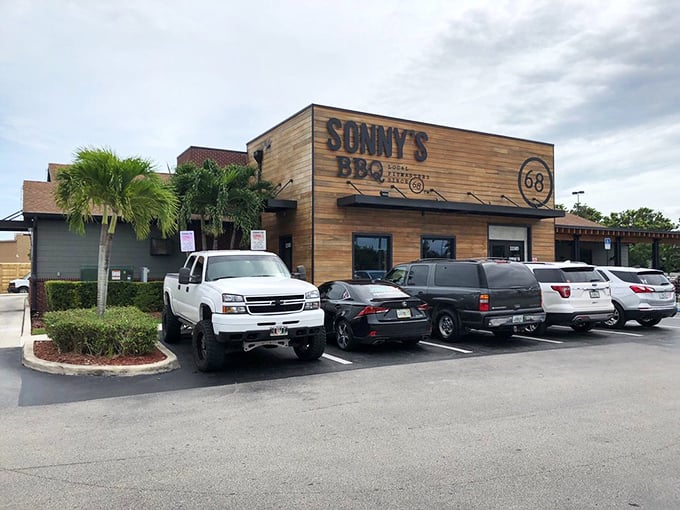 The parking lot often tells the story—trucks, cars, and hungry people from all walks of life converging for the universal language of good barbecue.