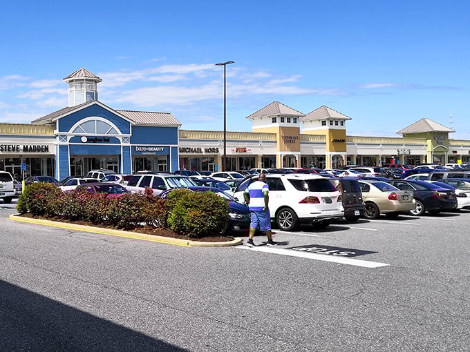 The blue and yellow façades of Tanger's storefronts create a cheerful shopping landscape that's as inviting as the deals waiting inside.