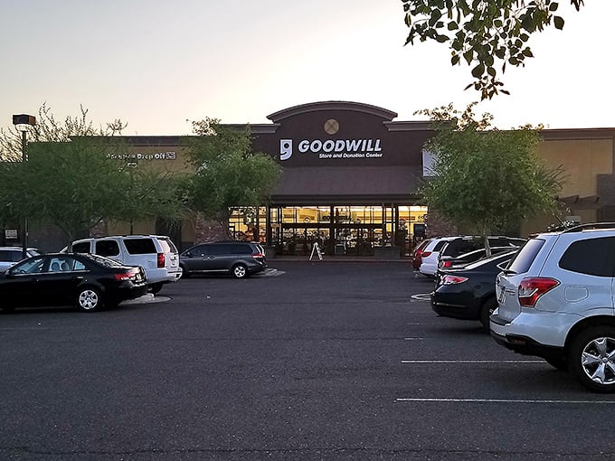 As evening approaches, the Goodwill's glow beckons shoppers for one last treasure hunt—tomorrow's inventory will tell completely different stories.