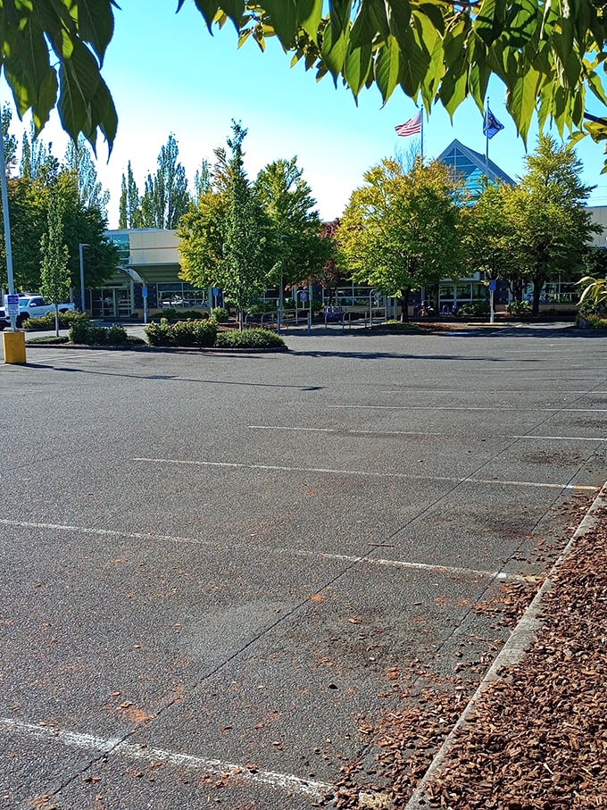 A spacious parking lot surrounded by Portland's signature greenery—because the universe knows you'll need trunk space for all your thrifted treasures.