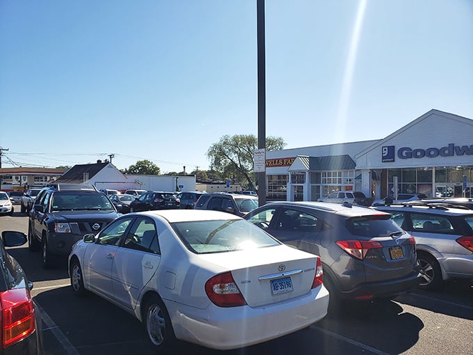 The bustling parking lot on a sunny day – proof that Connecticut's savviest shoppers know exactly where to find designer labels at garage sale prices.