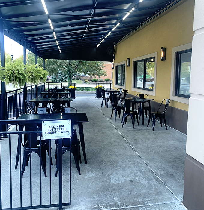The covered patio offers al fresco dining without the risk of syrup-stealing birds—breakfast engineering at its finest.