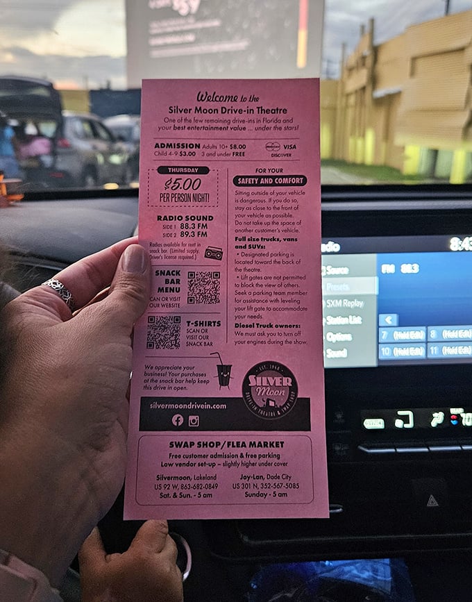 The pink ticket—your passport to an evening under the stars, complete with FM frequencies for that perfect movie soundtrack.