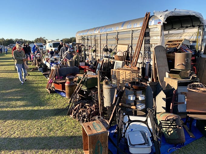 The ultimate flea market tableau—vintage Americana spilling from a silver trailer like a time capsule on wheels. Every item has a story; every price is negotiable.