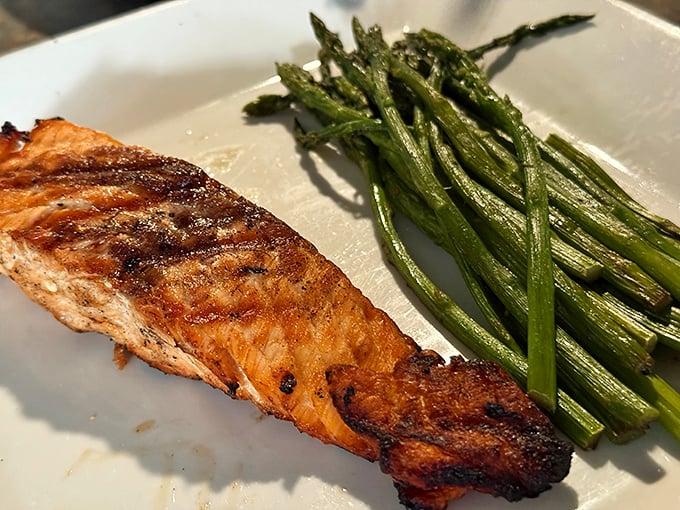 Perfectly grilled salmon with roasted asparagus proves Steis's isn't just about comfort food—they can nail the healthy options too.
