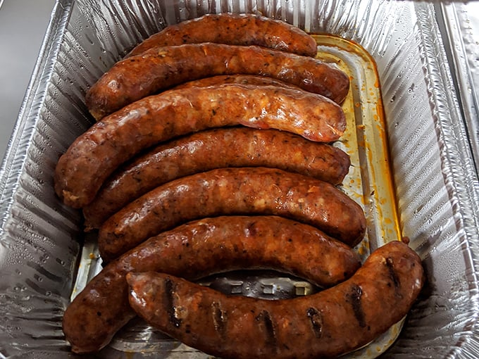 Sausages glistening with smoky promise—each link a testament to the art of proper BBQ technique.