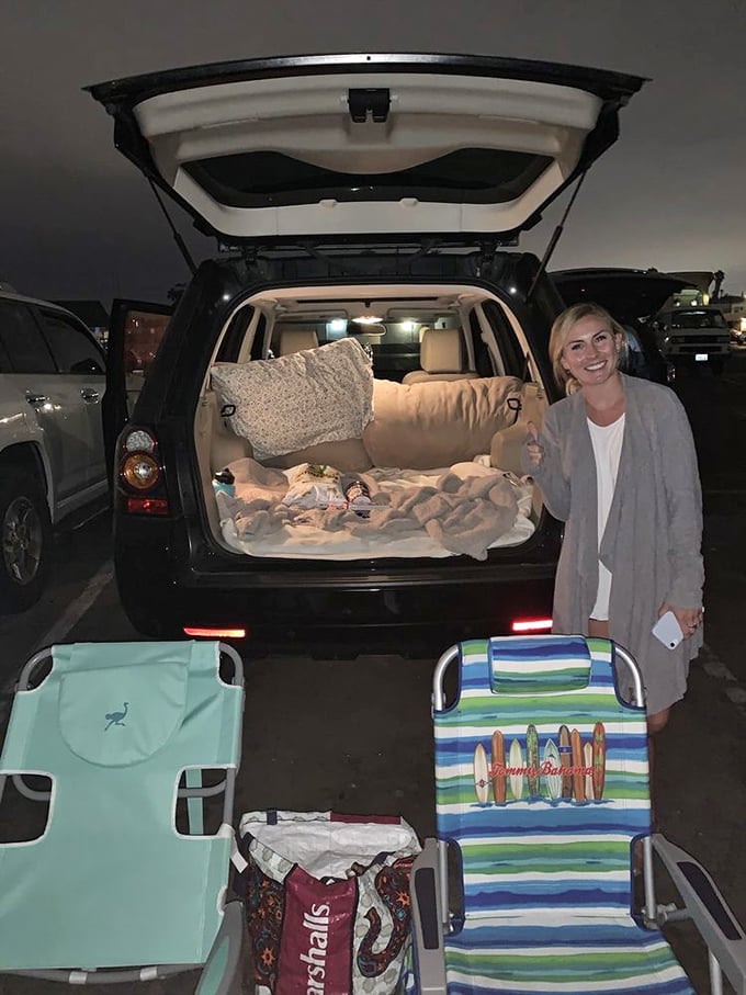 Drive-in innovation at its finest—an SUV transformed into a cozy nest of pillows and blankets, the ultimate mobile living room.