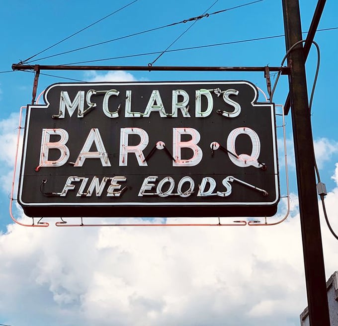 That iconic sign against an Arkansas sky—a beacon of hope for those seeking authentic barbecue in a world of pretenders.