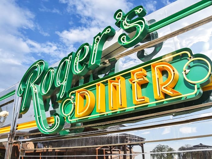 The neon sign glows like a beacon of hope for the hungry traveler – green and gold letters spelling out "salvation for empty stomachs."