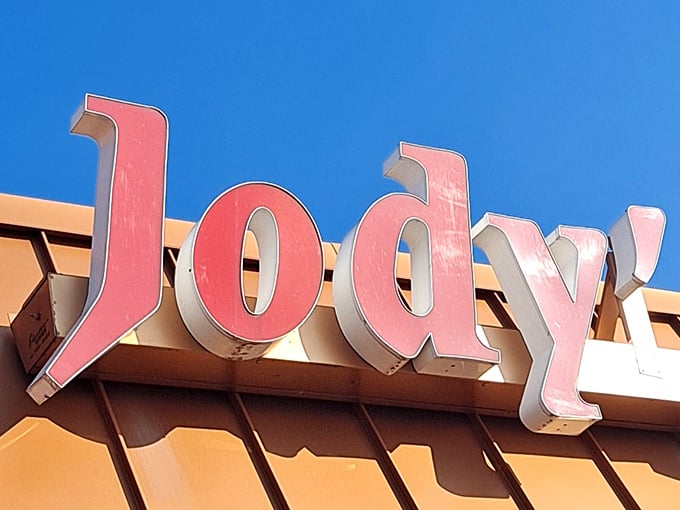 Those red letters against the blue sky spell out more than just a name—they're a promise of hot dog happiness waiting inside.