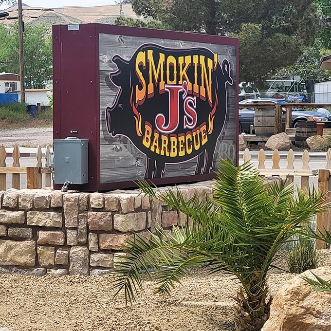 A sign that serves as both landmark and promise. That pig silhouette isn't just decoration—it's a beacon calling to hungry travelers across the desert.