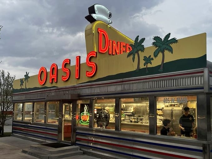 The illuminated sign promises what every weary traveler seeks – an oasis of coffee, comfort food, and conversation in a desert of chain restaurants and drive-throughs.