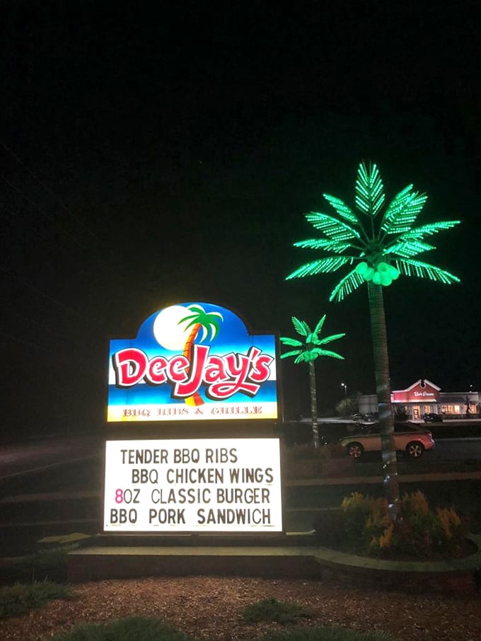 The nighttime signage glows like a neon promise. That illuminated palm tree isn't just decoration—it's a beacon of barbecue hope in the darkness.