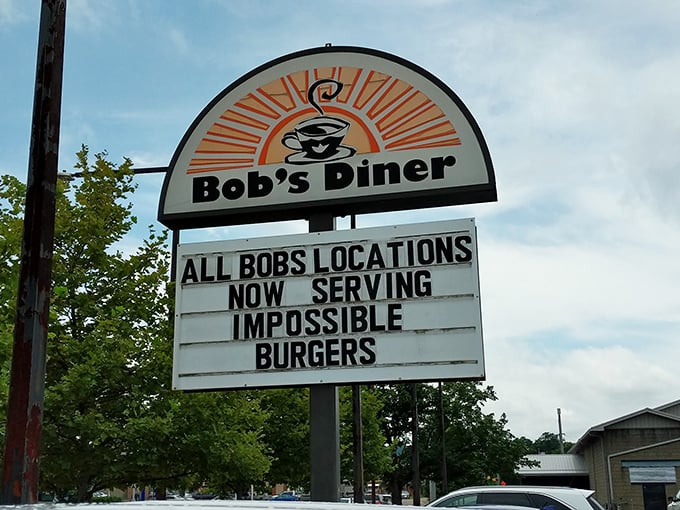 The sign doesn't just advertise—it proclaims. "Impossible Burgers" at Bob's could refer to either the plant-based option or the sheer challenge of finishing one.