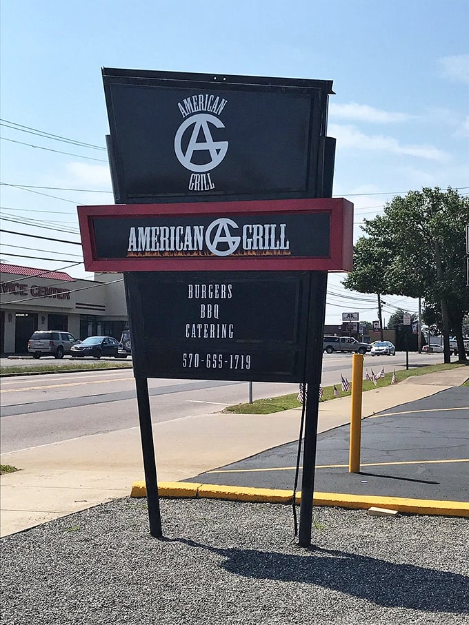 The roadside sign announces burgers, BBQ, and catering – three excellent reasons to make that turn right now.