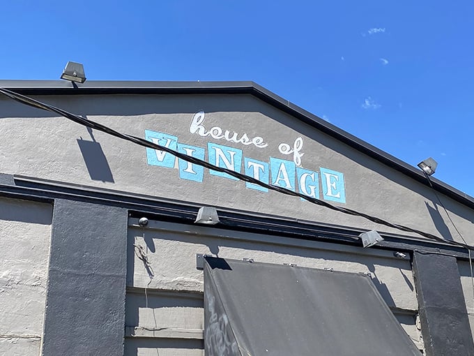 That iconic turquoise sign against Portland's rare blue sky – a beacon for treasure hunters and fashion archaeologists alike. Vintage paradise awaits below.