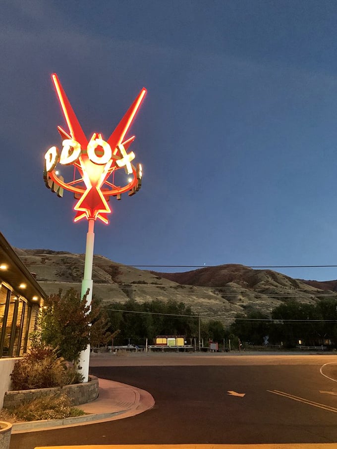 As dusk falls, the Maddox sign illuminates against Utah's mountains – a North Star for those guided by their appetites.