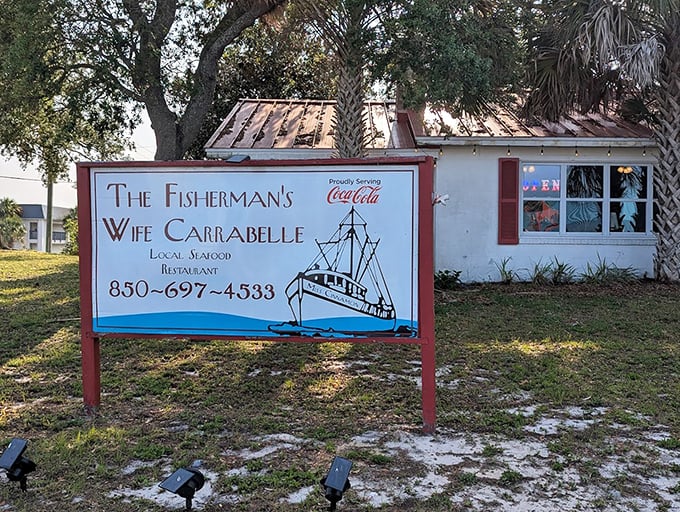 The sign promises local seafood in a setting where palm trees sway—a combination that's essentially Florida in restaurant form.