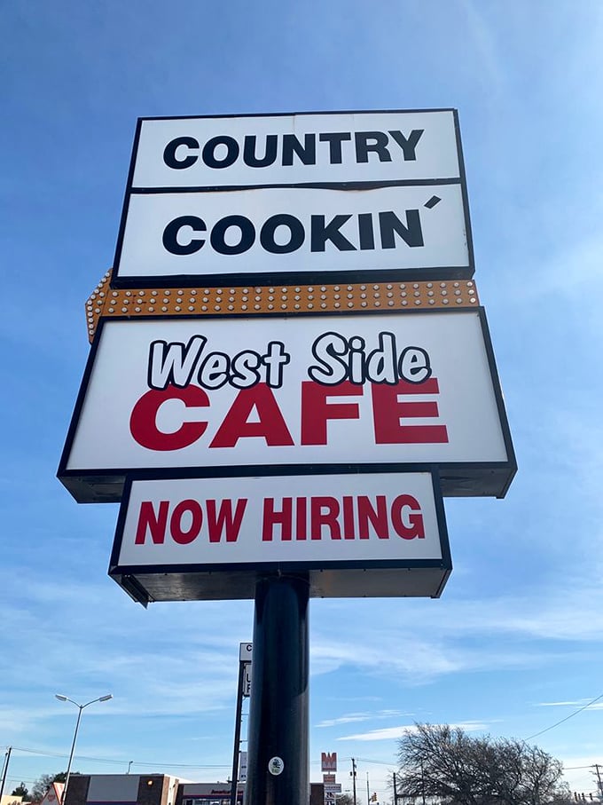 "Country Cookin'" isn't just a slogan on this roadside sign—it's a promise that West Side Cafe has been keeping to Fort Worth diners for decades.