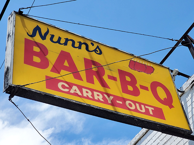 That iconic yellow and red sign has guided hungry souls to barbecue salvation for years—a beacon of hope in a world of mediocre meals.