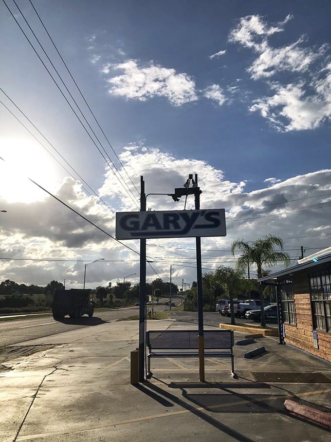 Against Florida's dramatic sky, Gary's sign stands as a beacon for seafood pilgrims—a landmark that's guided hungry travelers for generations.