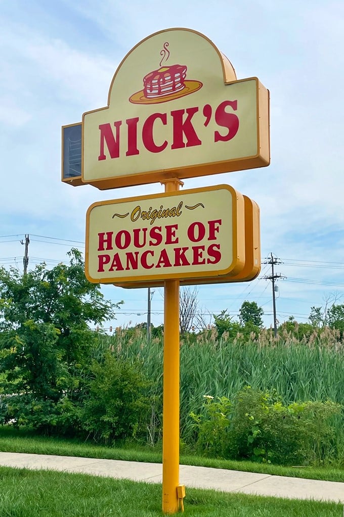 Standing tall against Michigan skies, this sign doesn't just mark a restaurant—it's a beacon of breakfast hope for miles around.