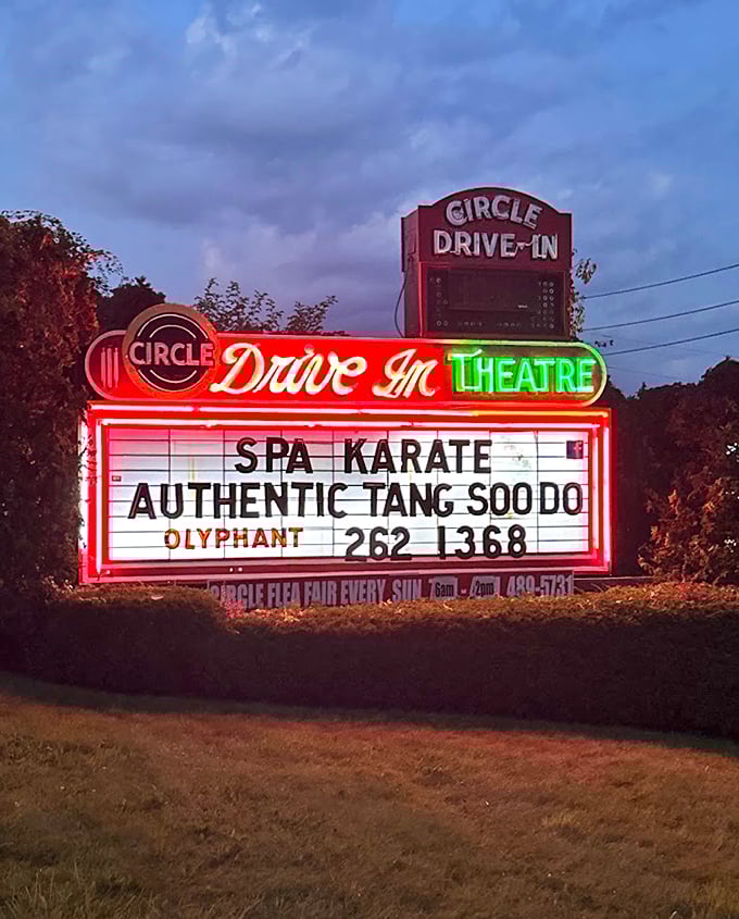 The neon marquee glows like a beacon in the Pennsylvania night, its vintage lettering a reminder that some things improve with age.