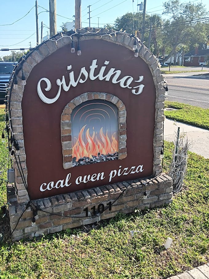 The sign says it all—coal-fired magic happens here. This isn't just restaurant signage; it's a beacon of hope for pizza lovers everywhere.