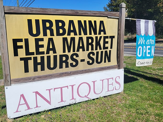 The welcoming sign that promises four days of treasure hunting each week. Like a yellow brick road marker, it points the way to antique adventures.