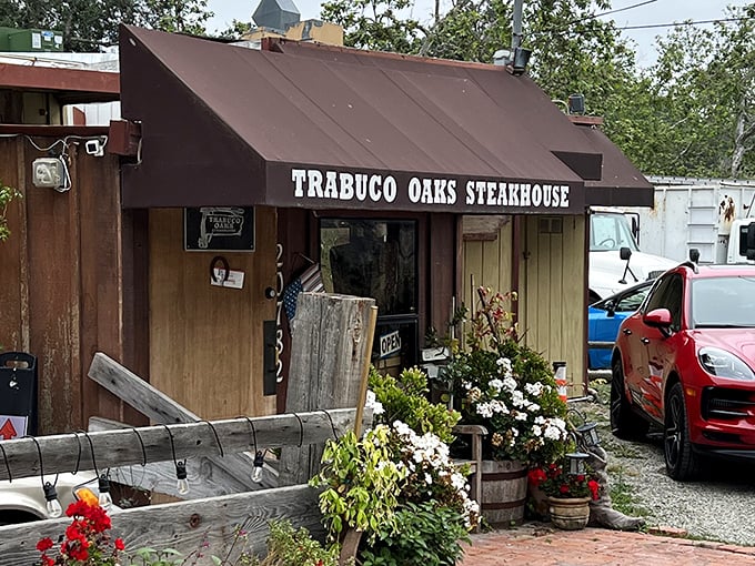The unassuming exterior belies the culinary treasures within—like finding a diamond mine disguised as a garden shed, but with better parking and flowering plants.