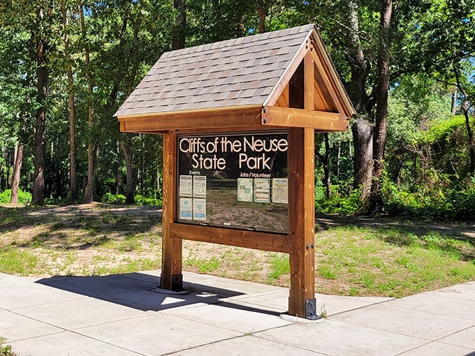 The welcoming entrance sign stands as a portal between everyday life and the natural sanctuary that awaits beyond.